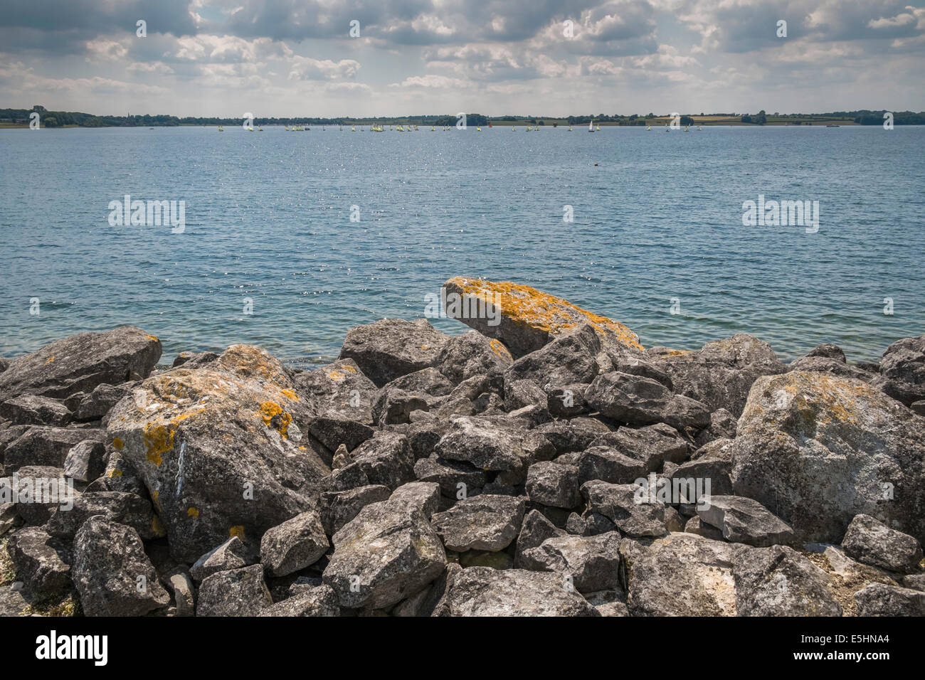 Rocks on waters edge at Rutland Water, Rutland, England UK Stock Photo ...