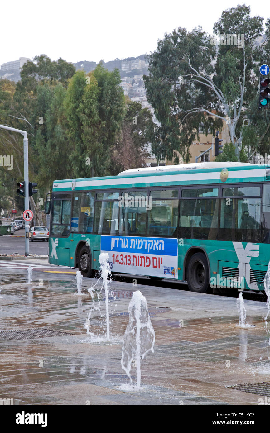 Bus in city centre showing fountain, Haifa, Israel Stock Photo - Alamy