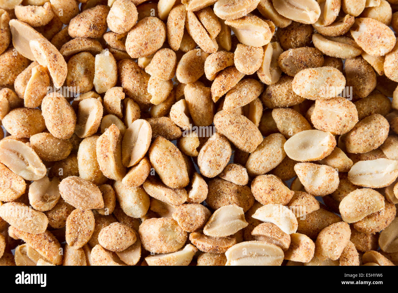 Dry roast peanuts, close up so they form a background or macro Stock ...