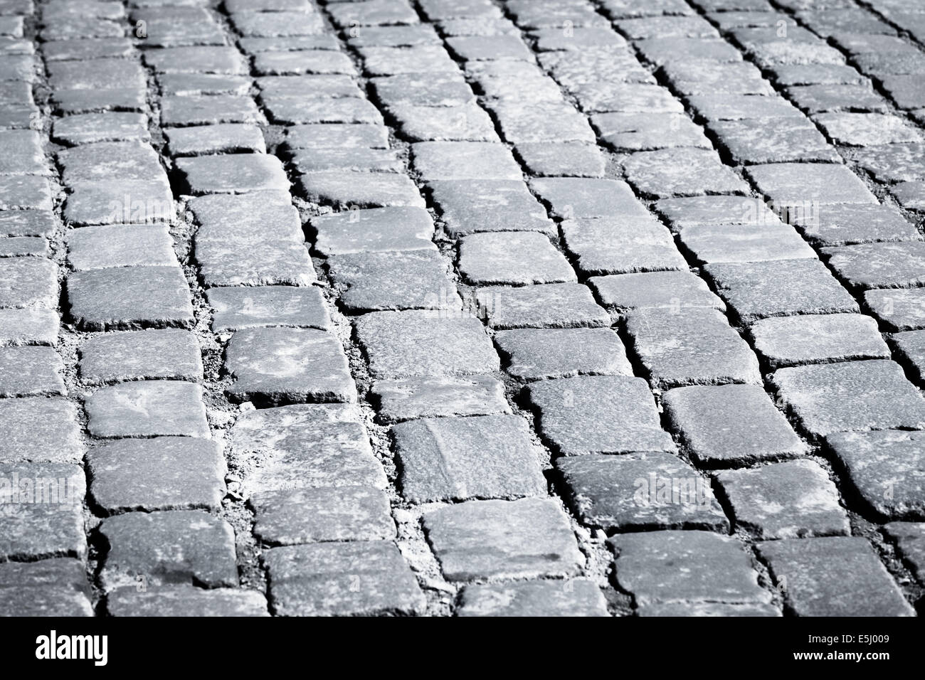 Granite old stone road texture as a background Stock Photo - Alamy