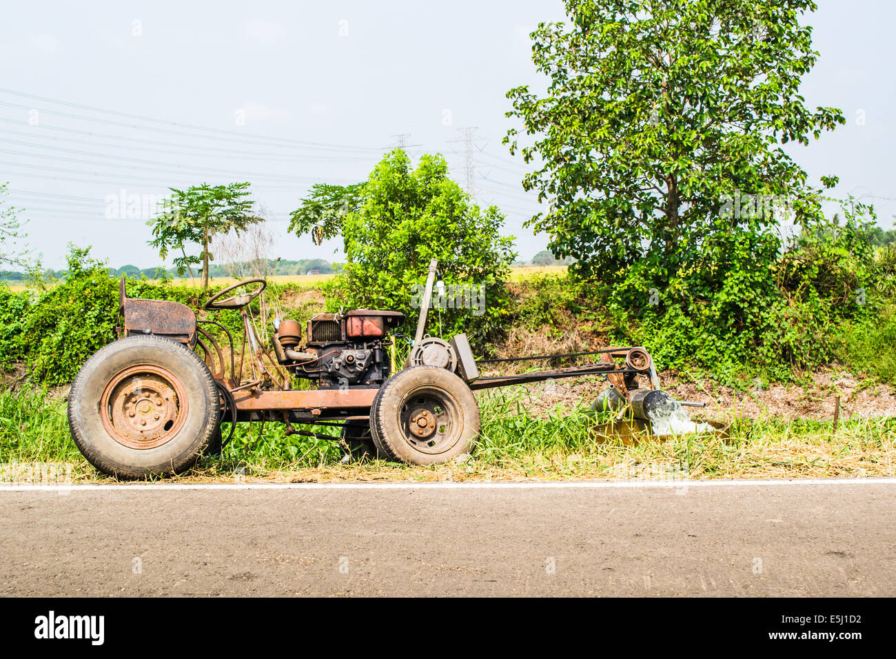 Farmer pump water to rice field for crop paddy plantation with ...