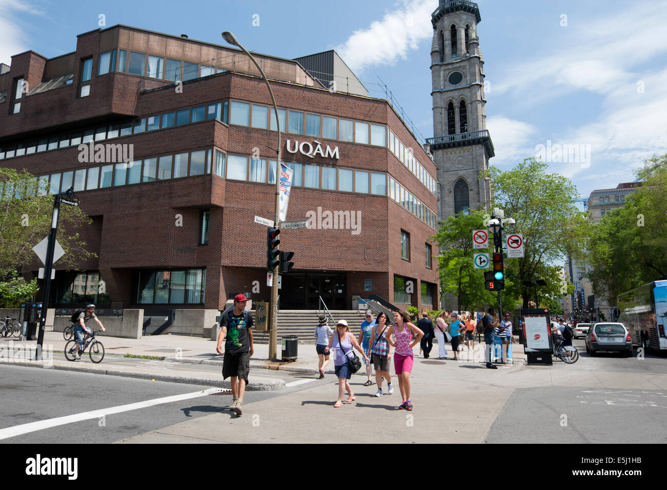 Pedestrians crossing the street in front of the main pavilion of the ...