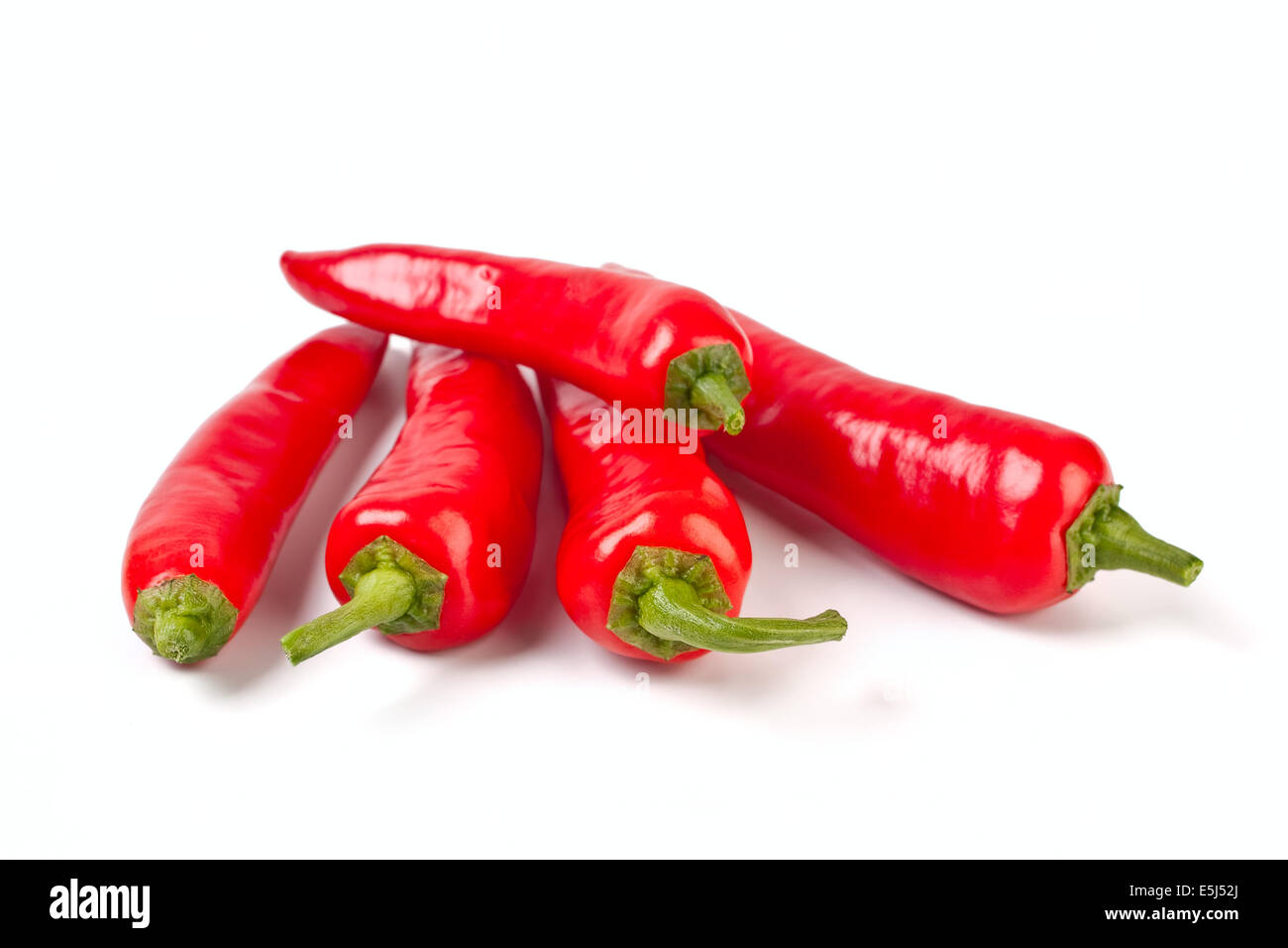 a group of five hot red chilly peppers Stock Photo - Alamy