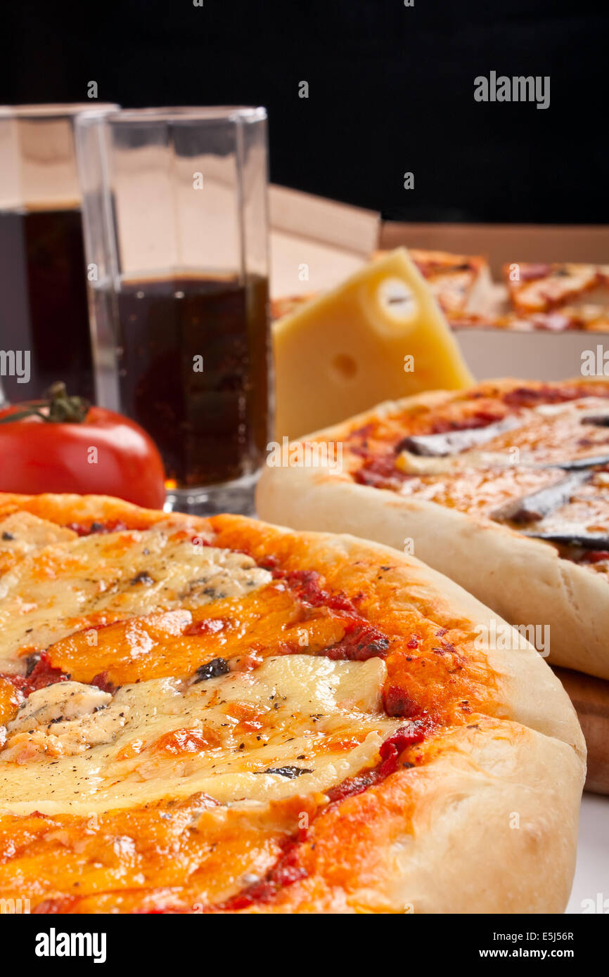 Four Cheeses Pizza and Cola Stock Photo - Alamy