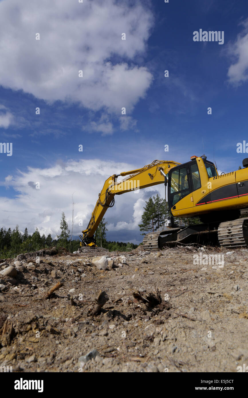 Excavator at a construction site Stock Photo - Alamy