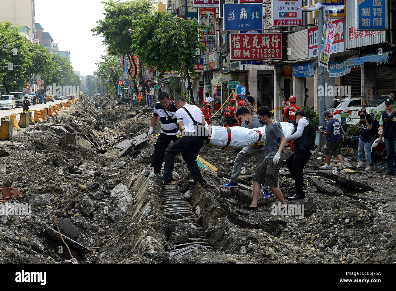 Kaohsiung, China's Taiwan. 2nd Aug, 2014. Rescuers carry bodies of ...