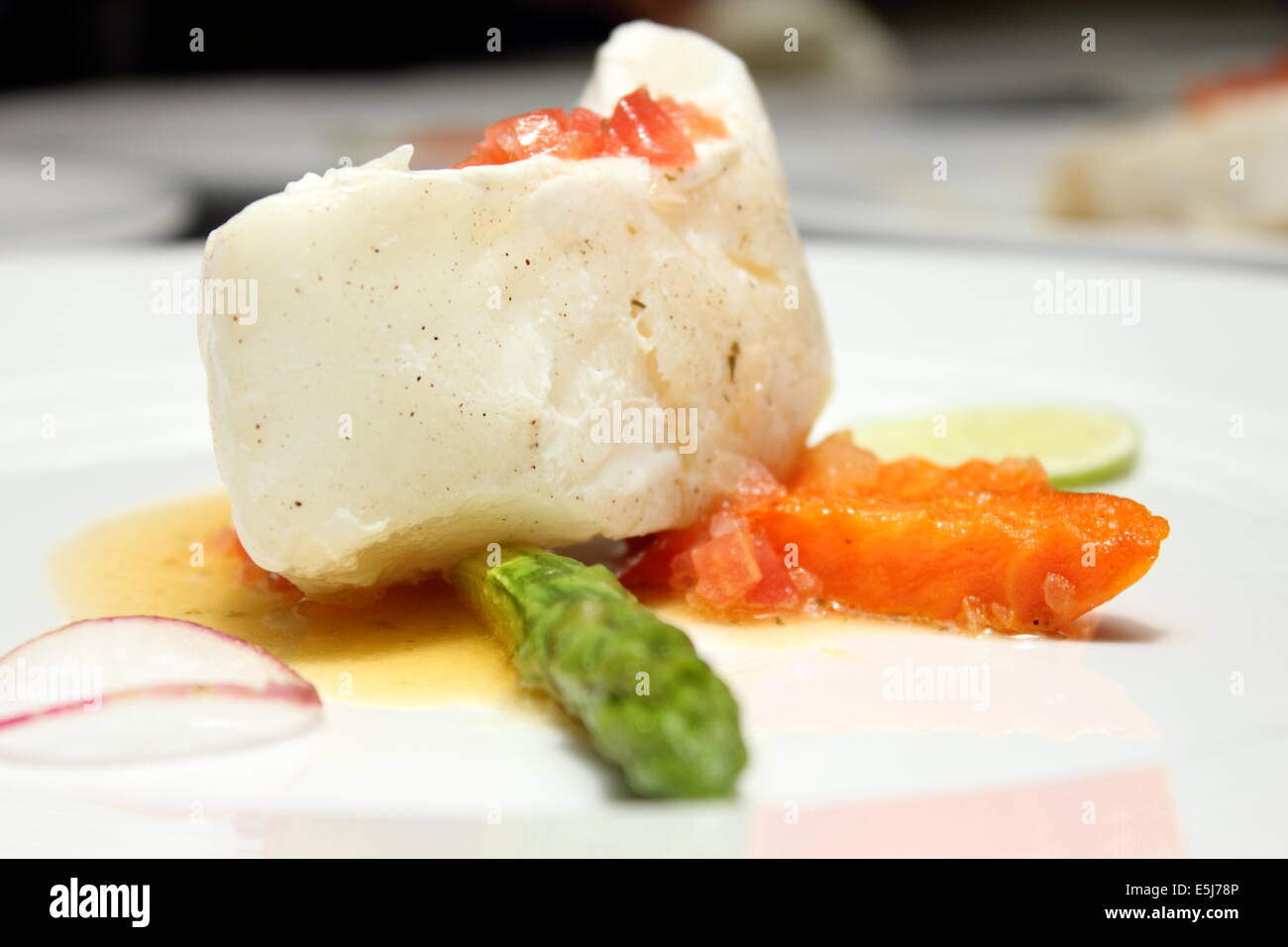 A snow fish steak and sauce Stock Photo - Alamy