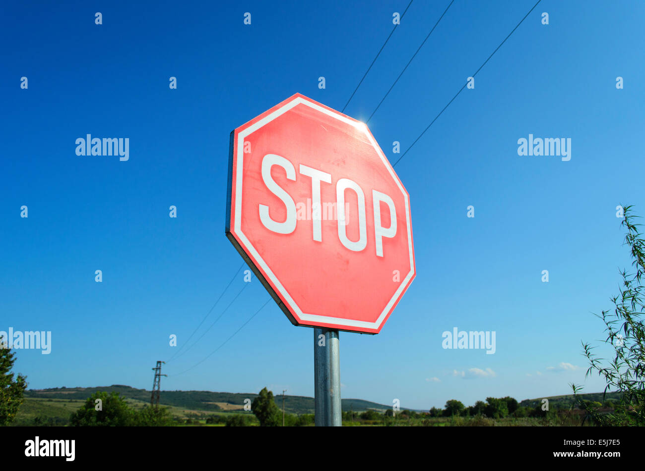 Stop sign in country road Stock Photo - Alamy