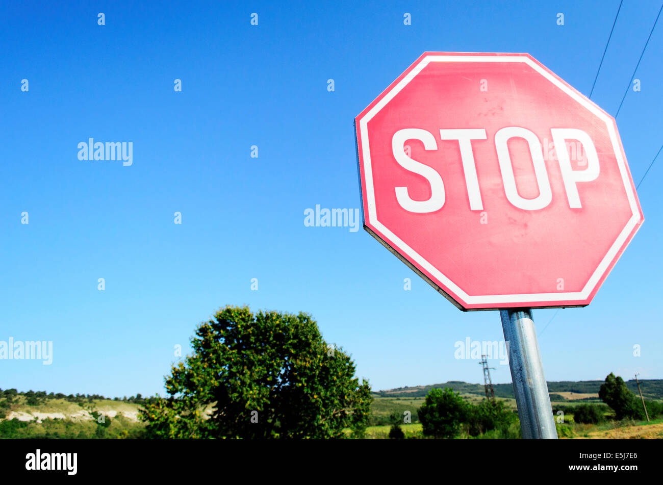 Stop sign in the road hi-res stock photography and images - Alamy