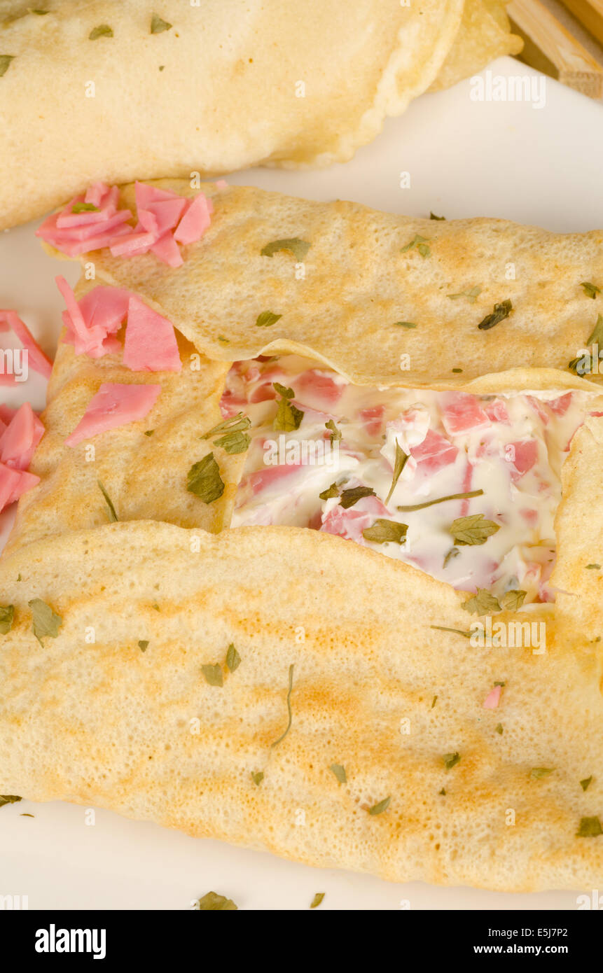 Folded crepe stuffed with fresh ham and cheese Stock Photo - Alamy
