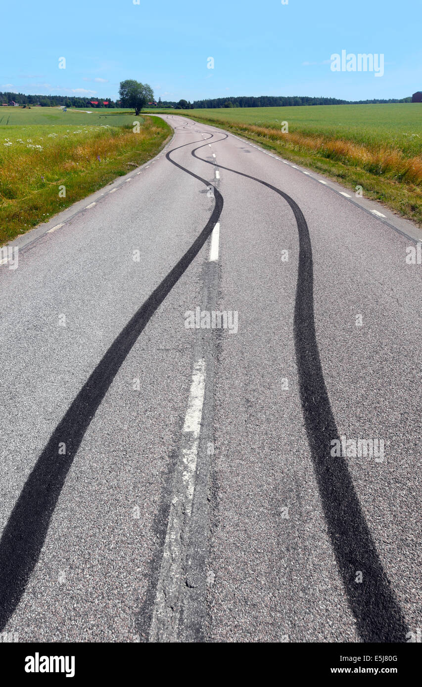 Tire print on the asphalt road Stock Photo - Alamy