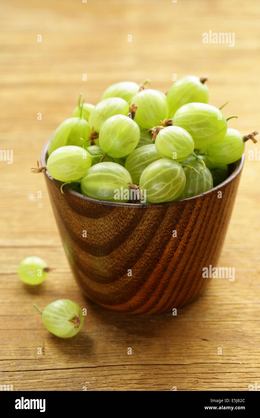 fresh ripe green gooseberries on wooden table Stock Photo - Alamy