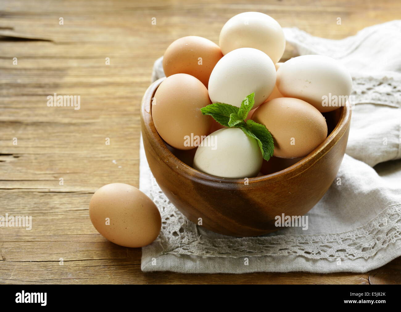 natural organic eggs in a wooden bowl Stock Photo - Alamy