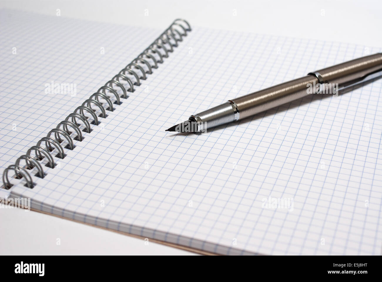 Pen on a notebook Stock Photo - Alamy
