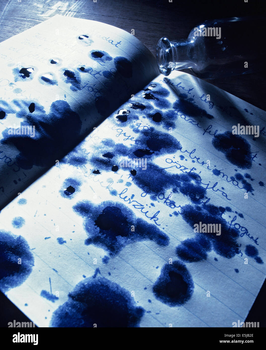 Ink droplets on a booklet Stock Photo - Alamy