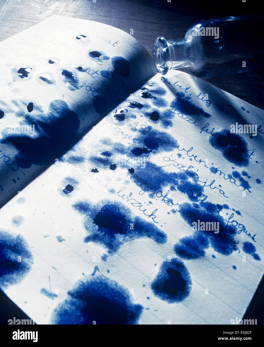 Ink droplets on a booklet Stock Photo - Alamy