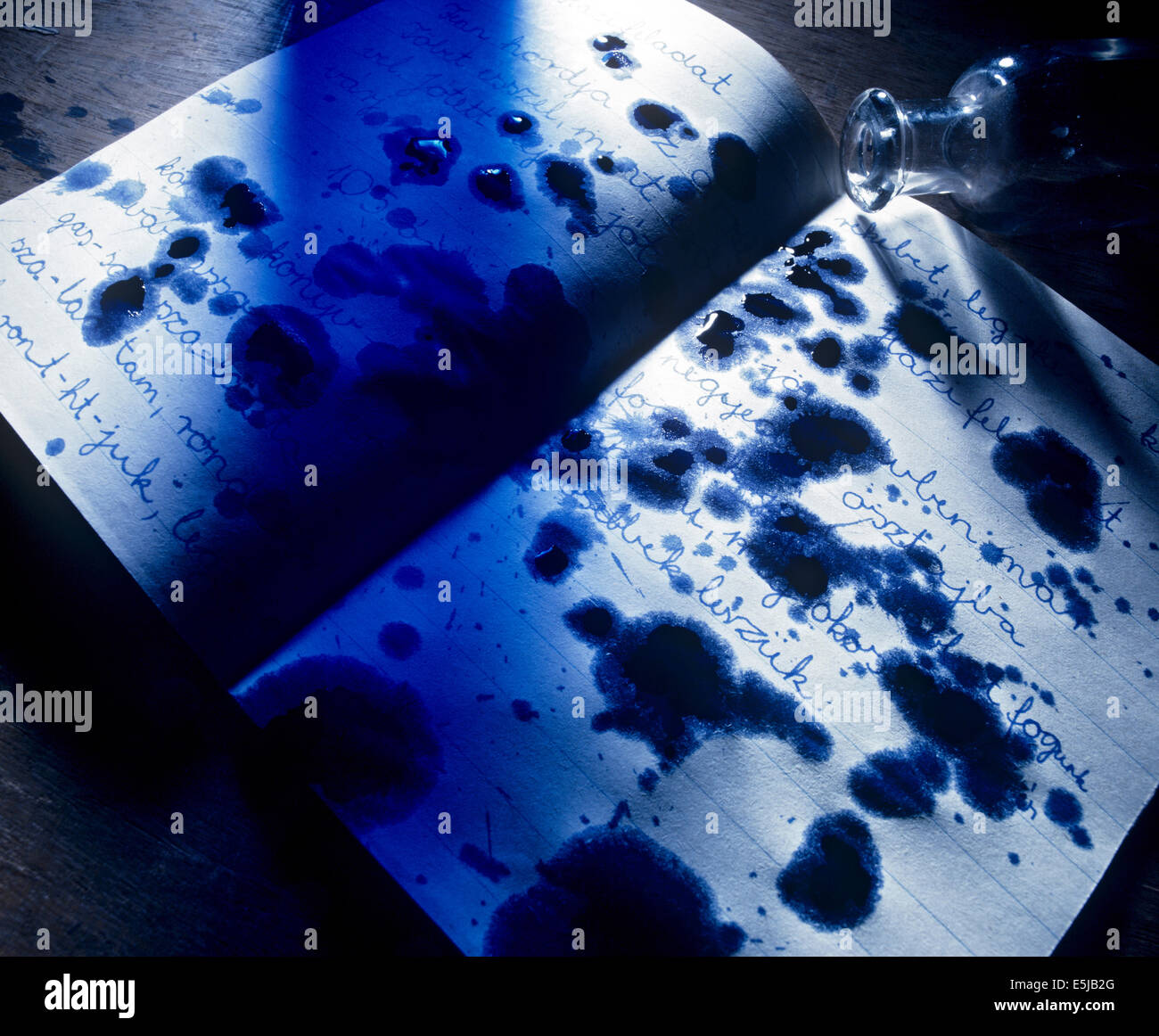 Ink droplets on a booklet Stock Photo - Alamy