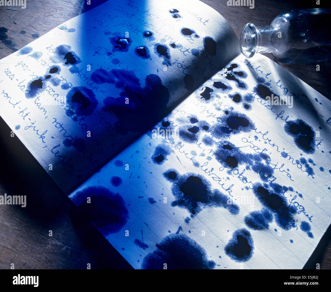 Ink droplets on a booklet Stock Photo - Alamy