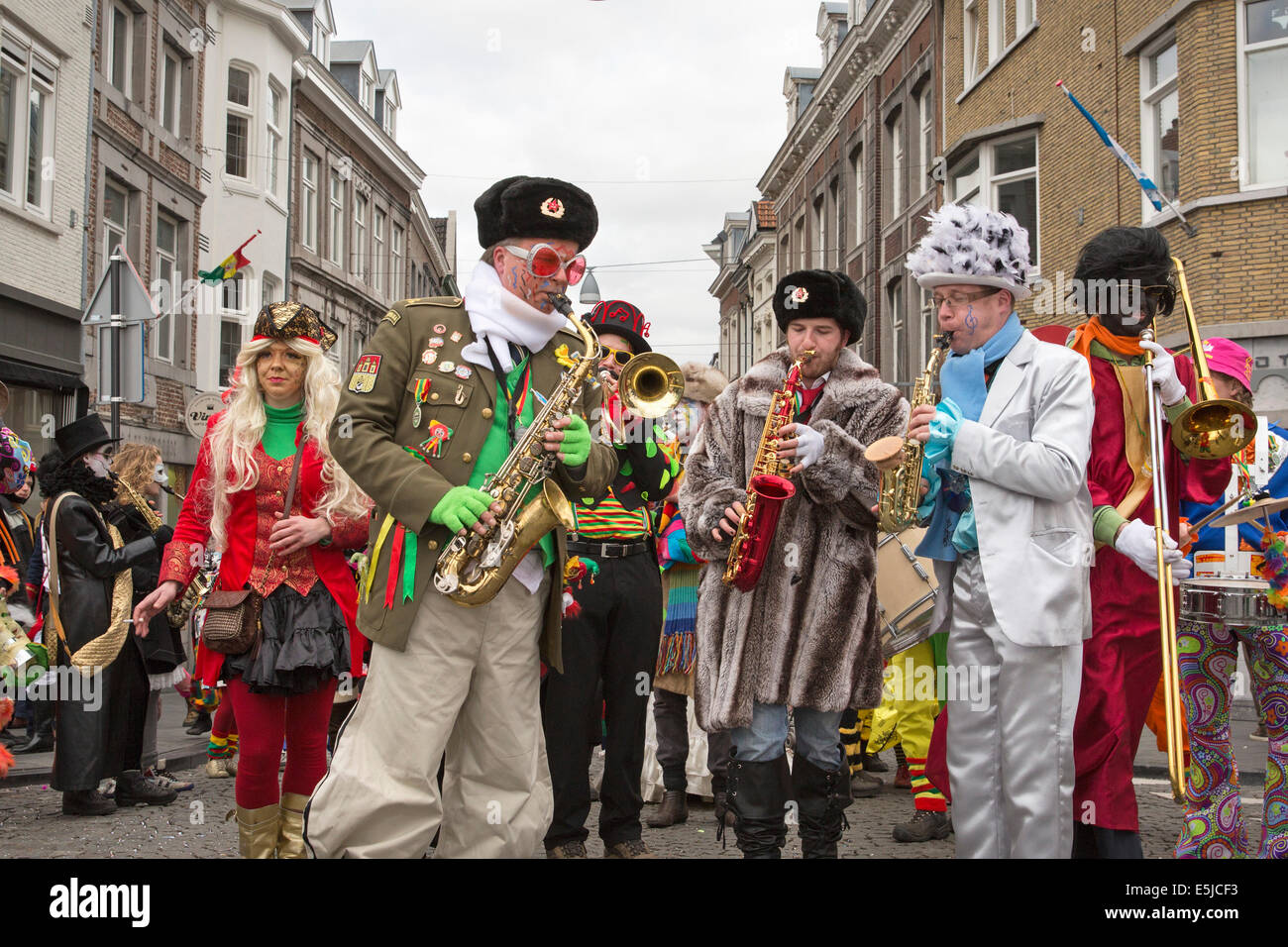Netherlands, Maastricht, Carnival festival. Costumed people in parade ...