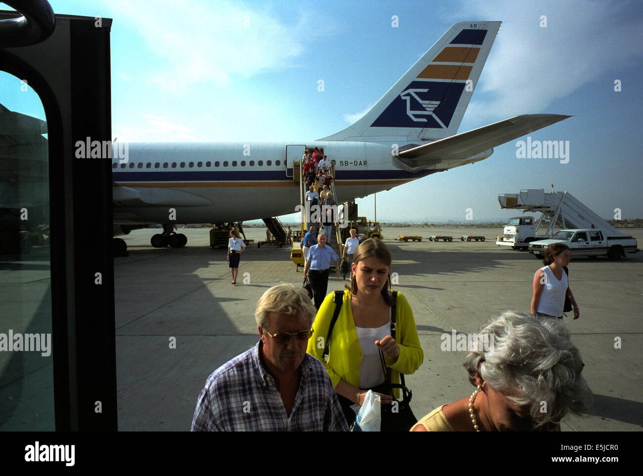 LARNACA, CYPRUS. PASSENGERS DISEMBARK FROM A CYPRUS AIRWAYS JET.PHOTO ...