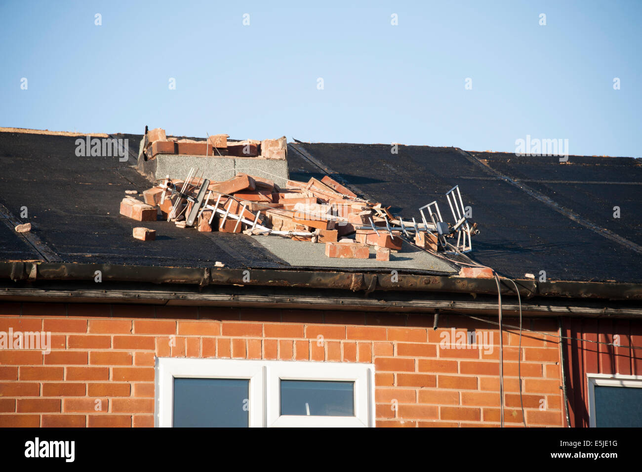Chimney stack collapsed roof storm damage insurance Stock Photo - Alamy