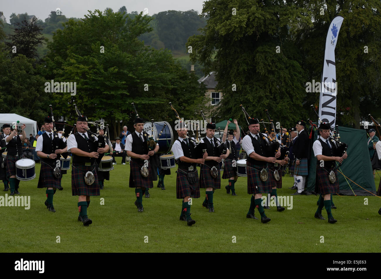 Melrose, UK. 02 Aug 2014. Melrose Pipe Band C/Ships Under scrutiny from ...