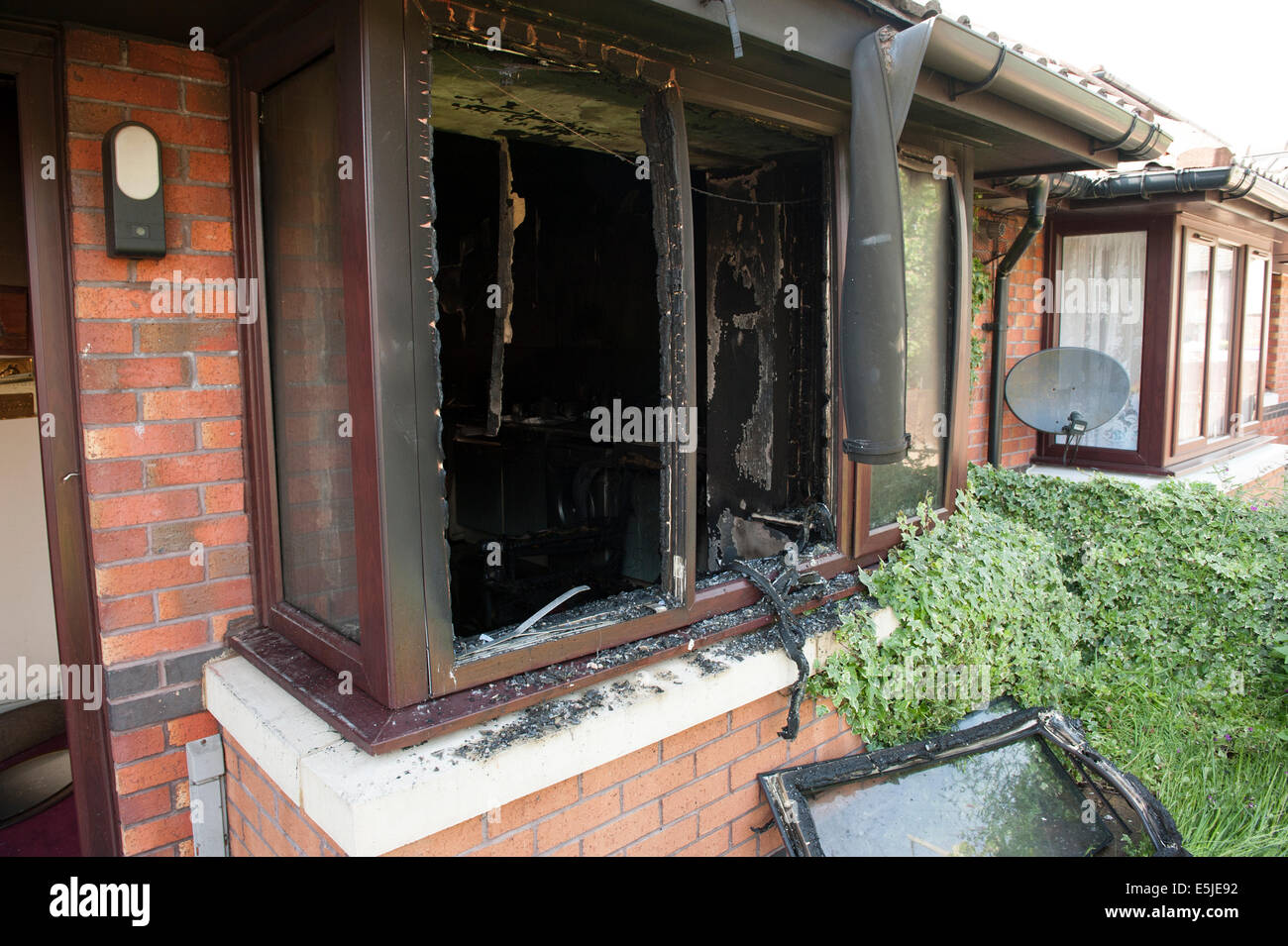 Severe house fire lounge window burnt rescue Stock Photo - Alamy