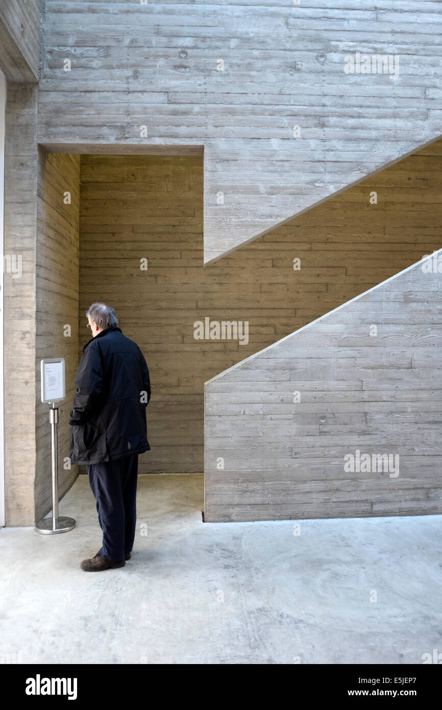 Man standing modern concrete architecture angular Stock Photo - Alamy