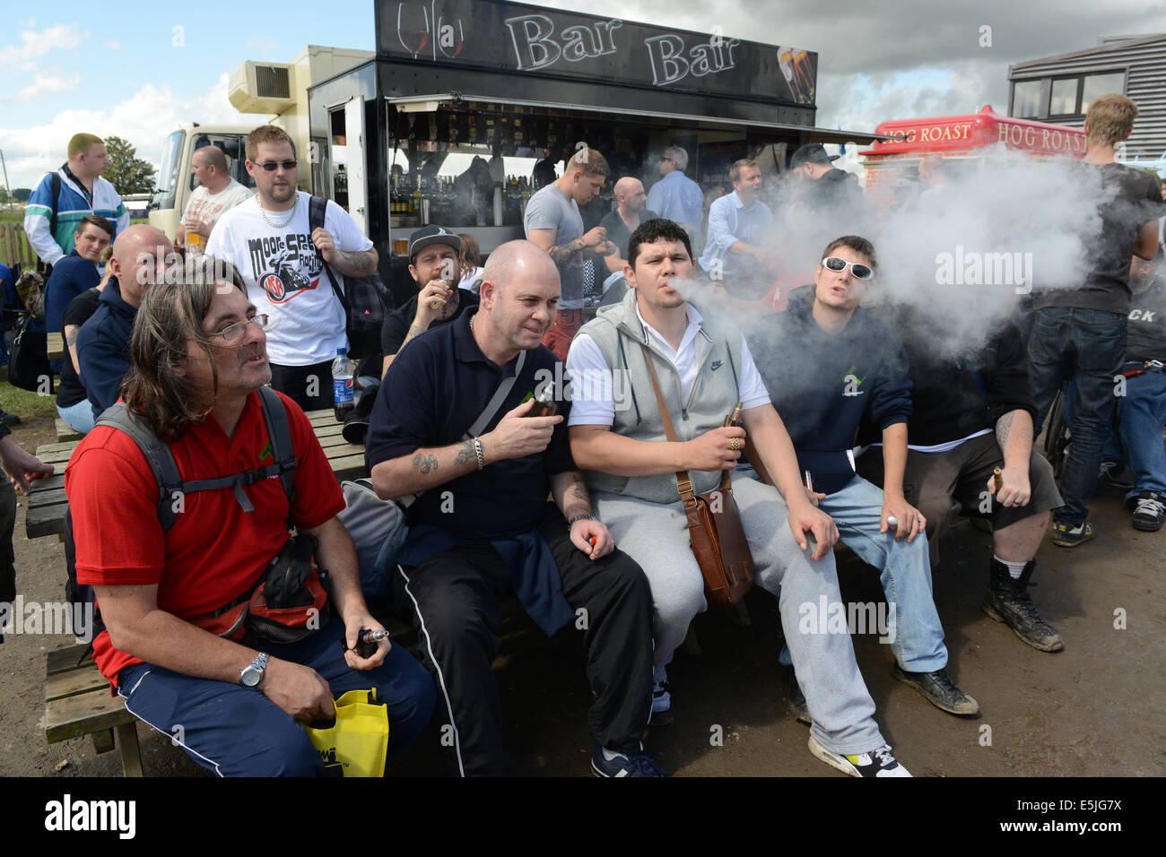 Vaping enthusiasts exhale from their e cigarettes at annual Vapour ...