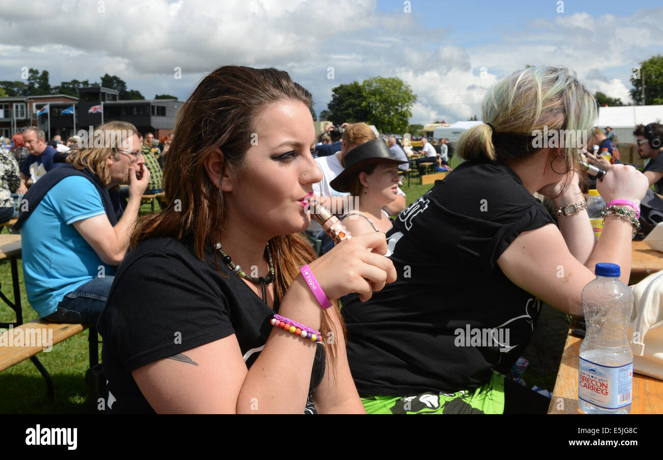 A young woman puffing on her vapouriser at the 2nd annual Vapour ...