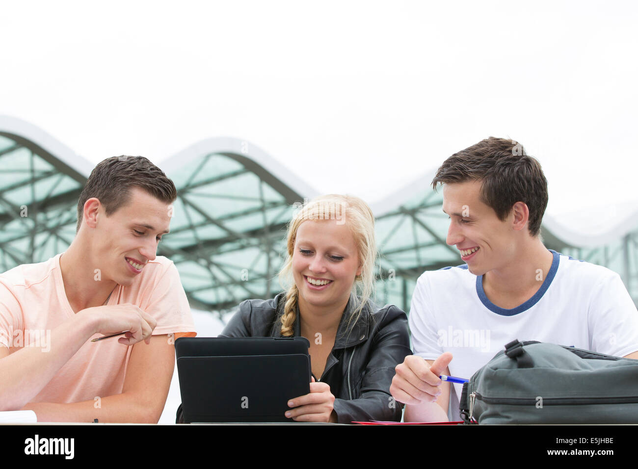 Students sitting together Stock Photo - Alamy