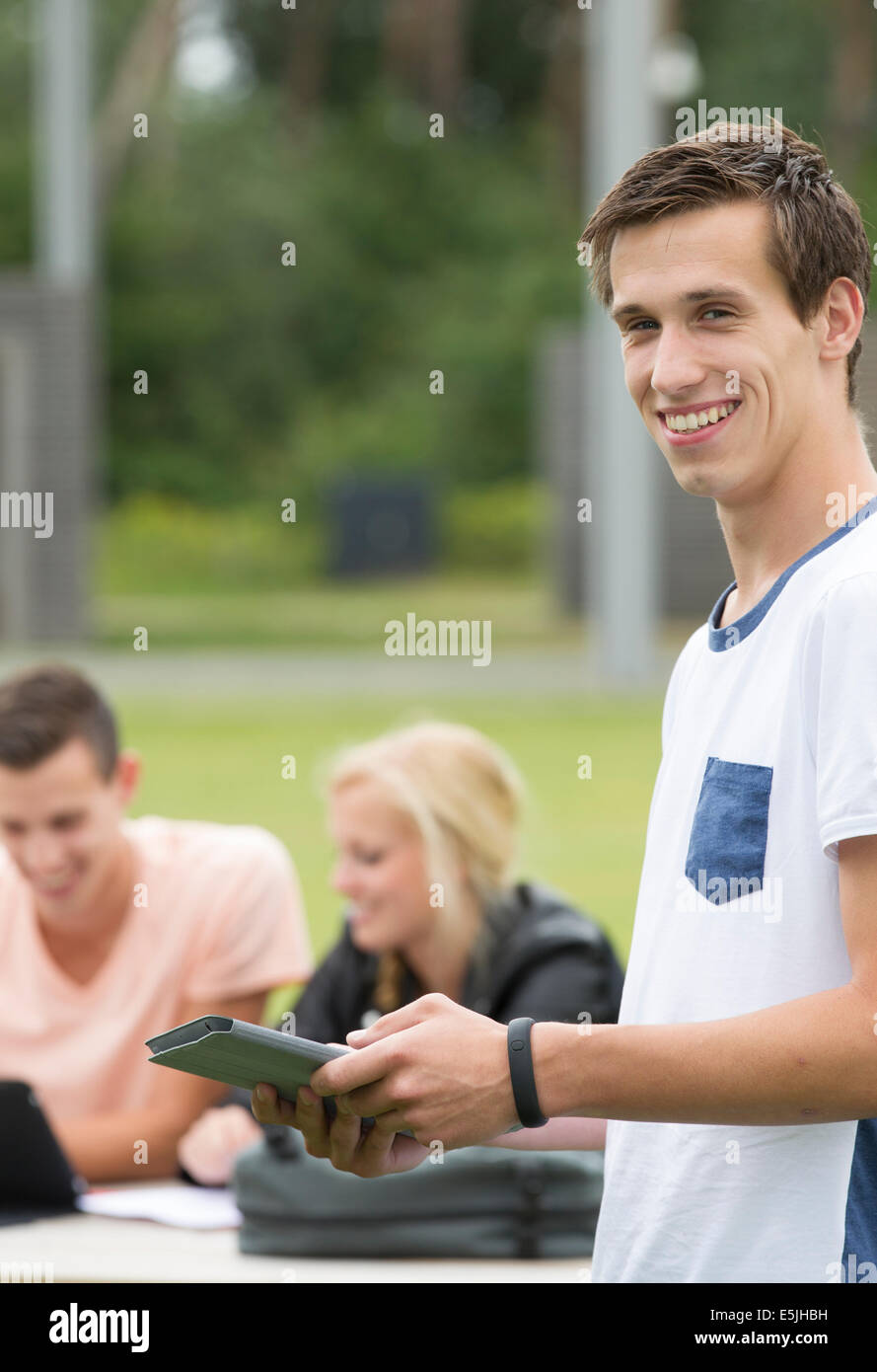 Students sitting together Stock Photo - Alamy