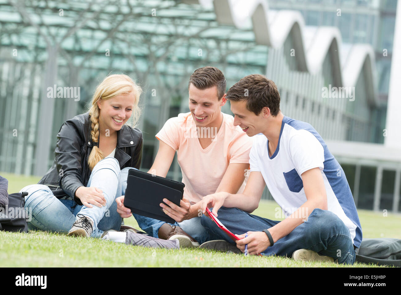 Students sitting together Stock Photo - Alamy
