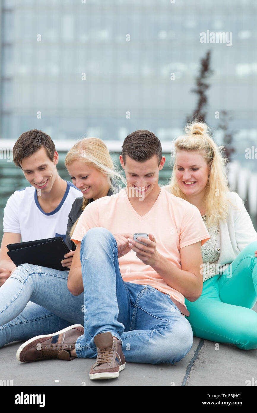Students sitting together Stock Photo - Alamy