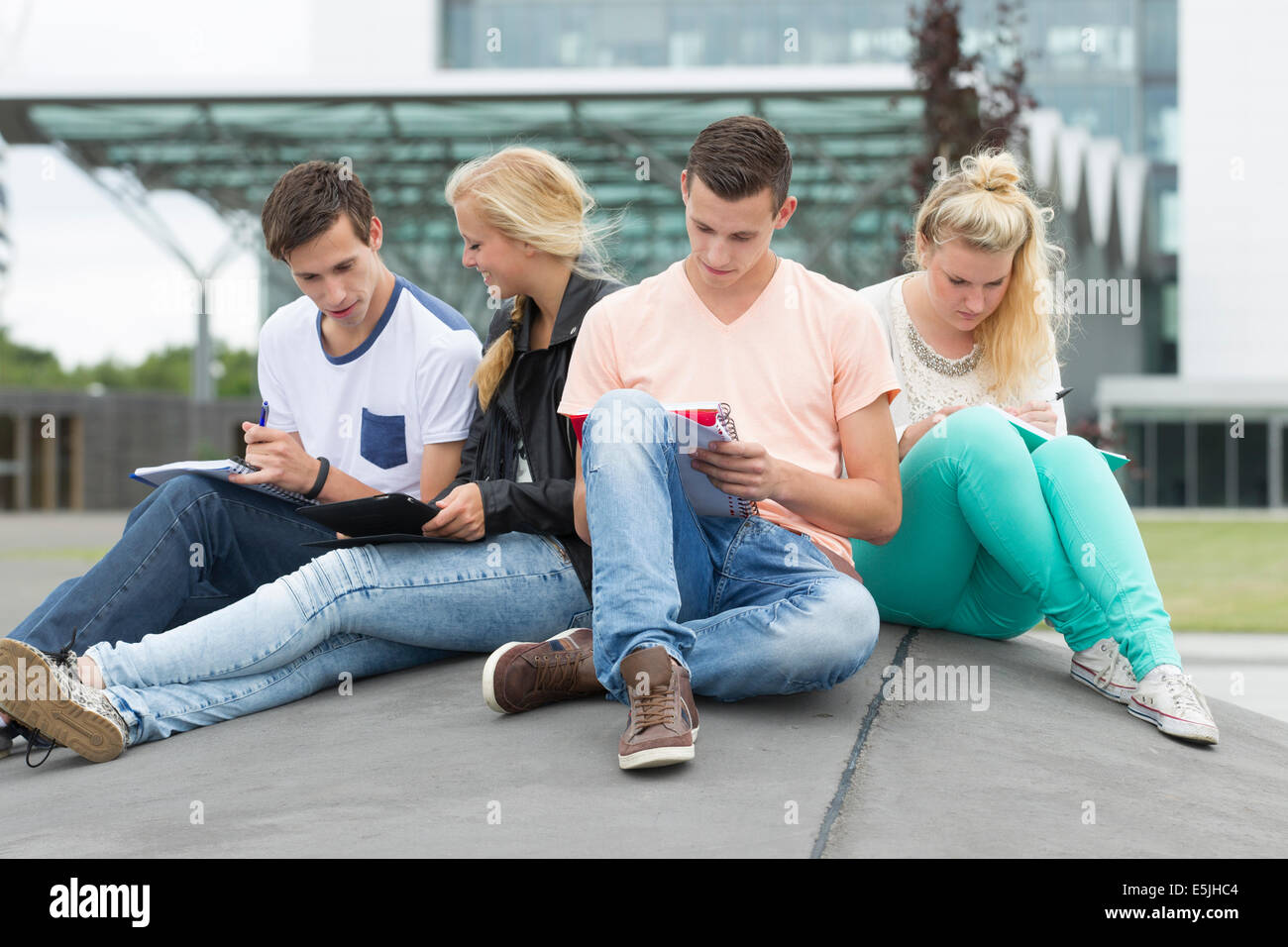 Students sitting together Stock Photo - Alamy