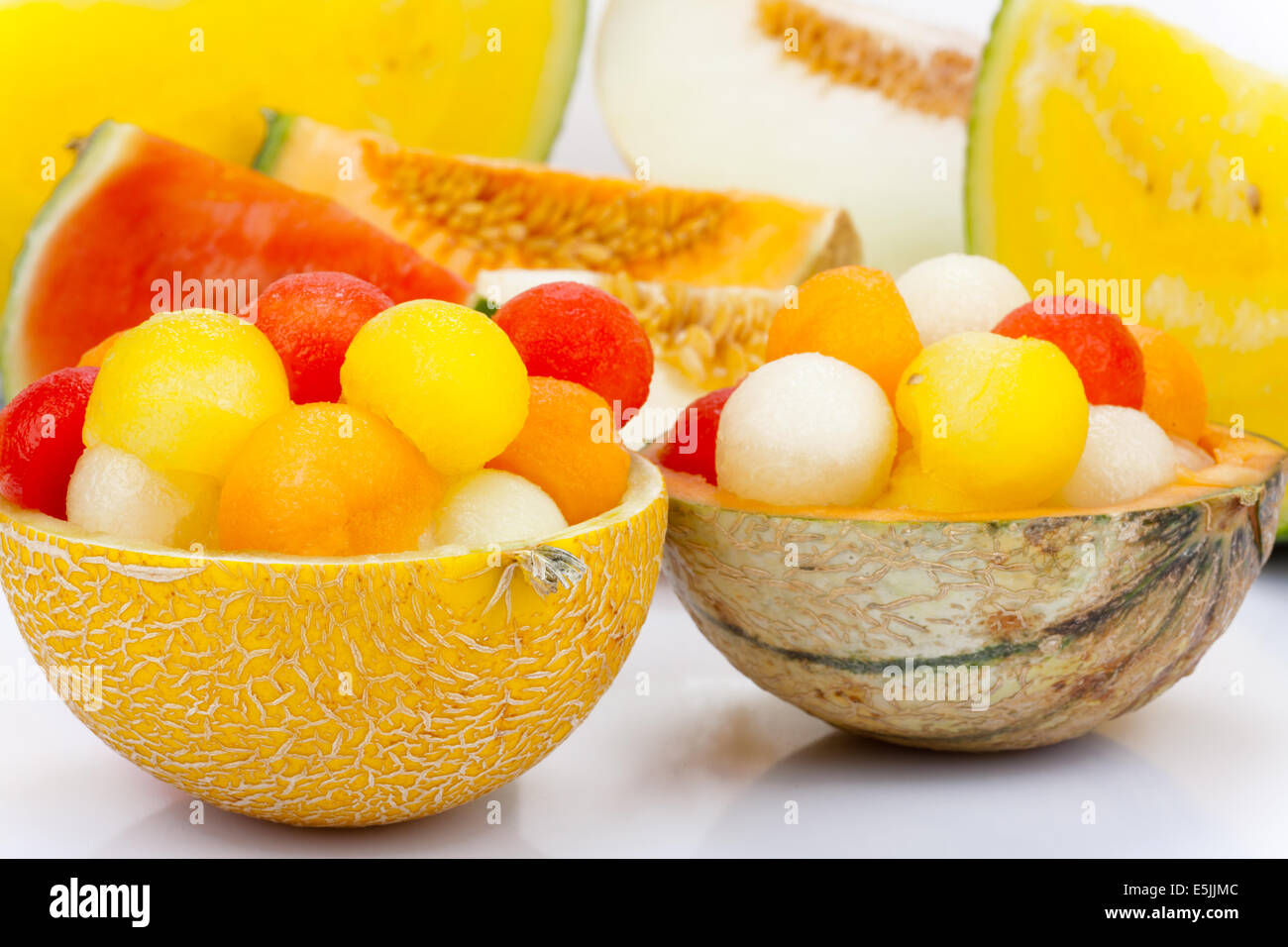 Melon as a bowl for melon balls isolated on white Background Stock ...