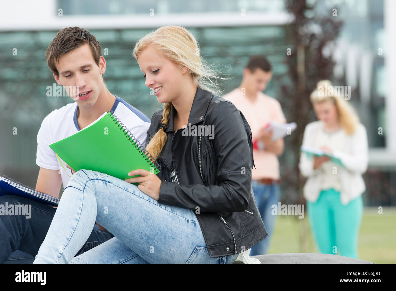 Students sitting together Stock Photo - Alamy