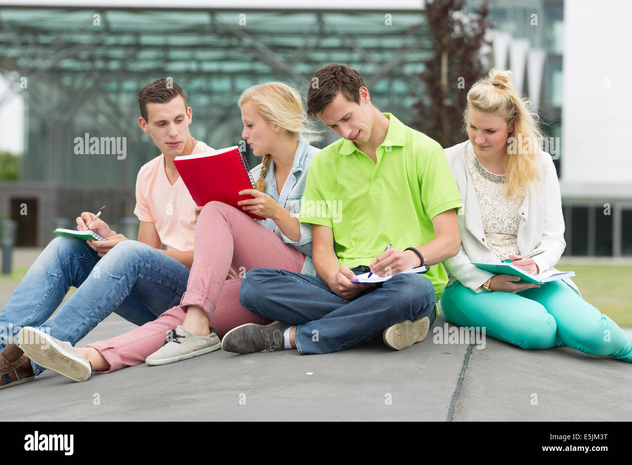 Students sitting together Stock Photo - Alamy