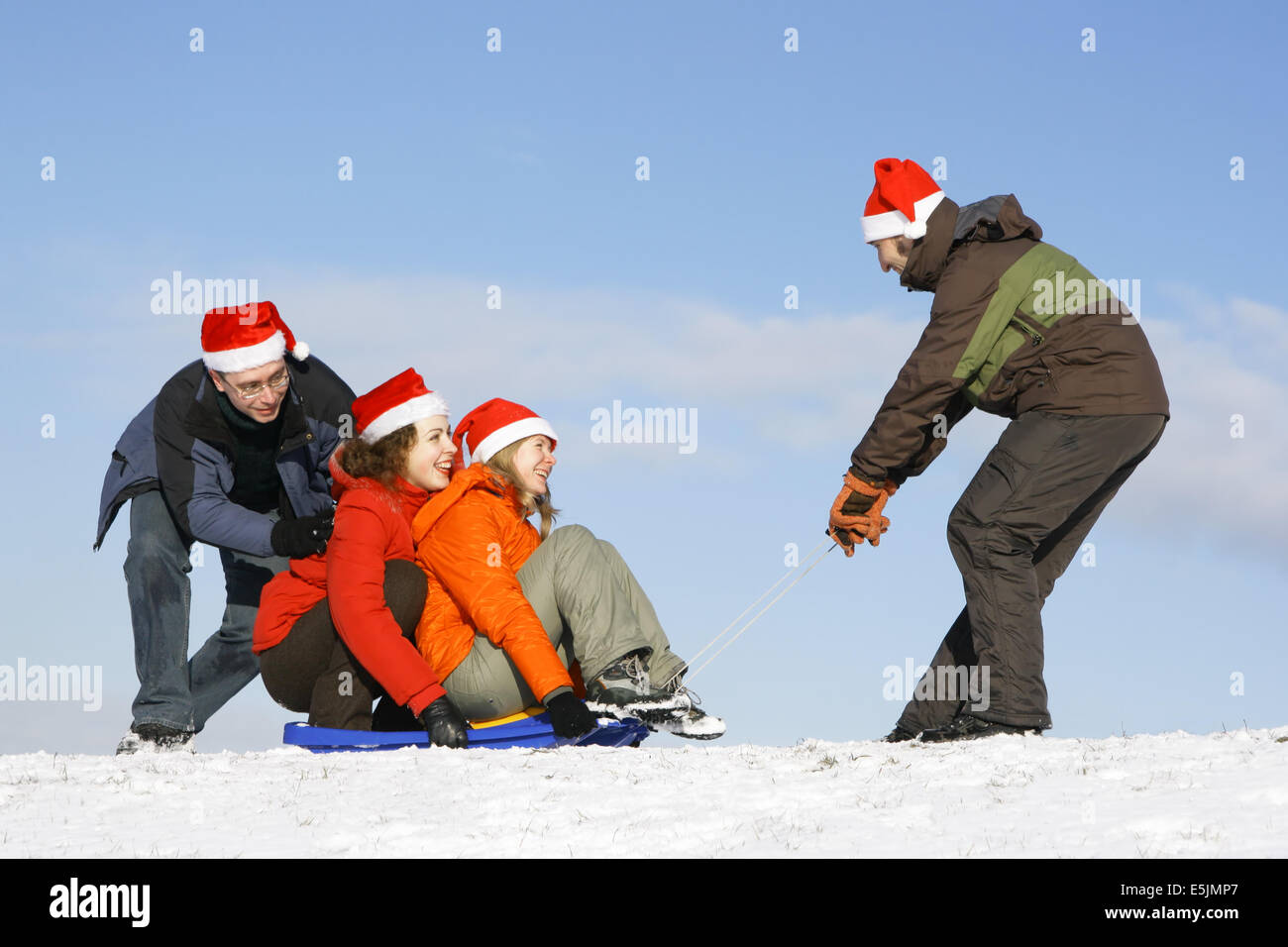 Friends to drive in sled in winter Stock Photo - Alamy