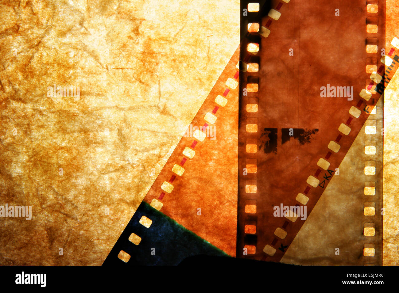 Processed film strips close-up over grunge background Stock Photo - Alamy