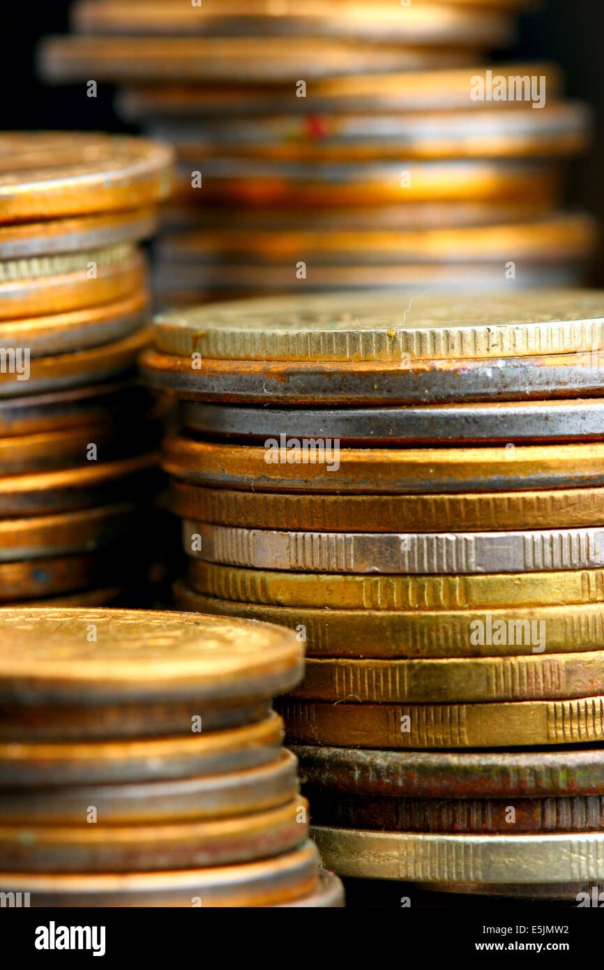Coins stacks close-up over black background Stock Photo - Alamy
