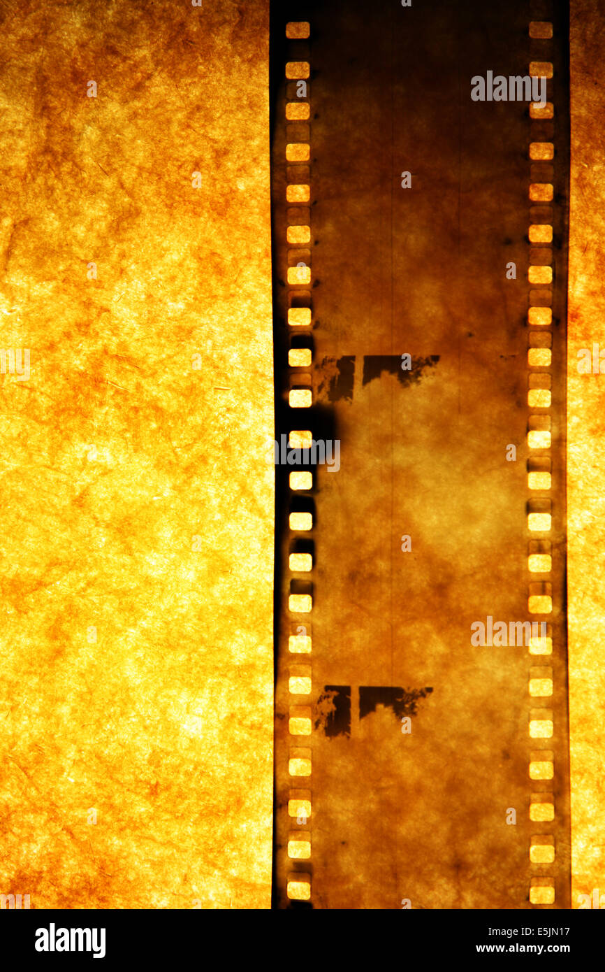 Old film strip over grunge paper background Stock Photo - Alamy
