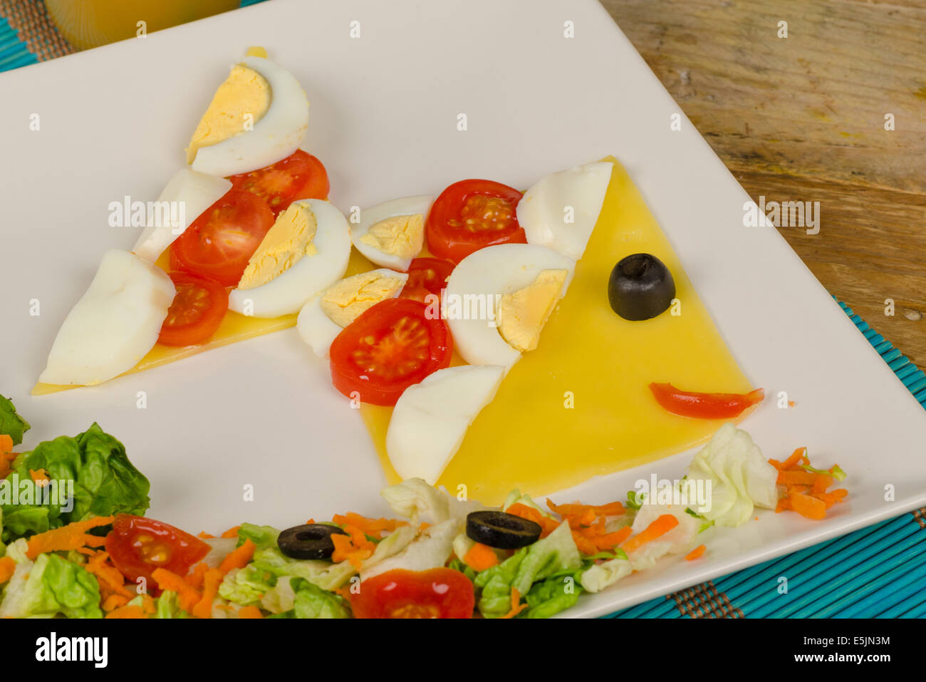 Colorful salad shaped as a fish, creative kid food Stock Photo - Alamy