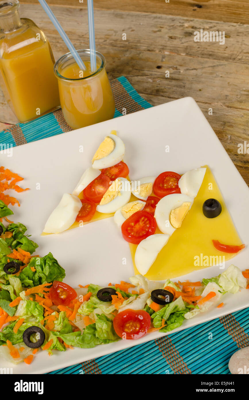 Colorful salad shaped as a fish, creative kid food Stock Photo - Alamy