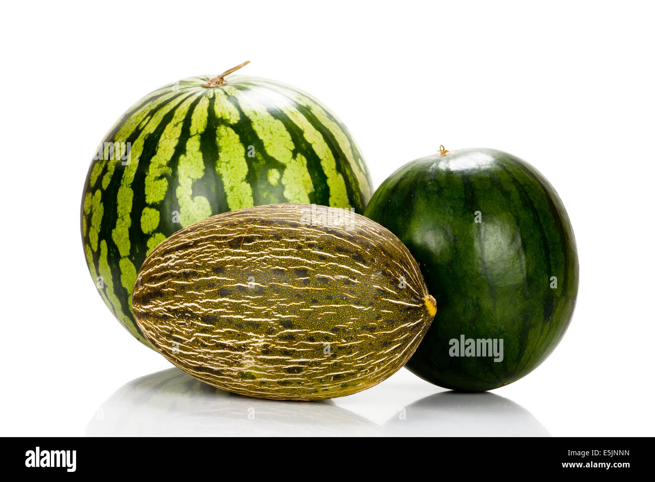 Three Different varieties of melons mirrored and isolated on white ...