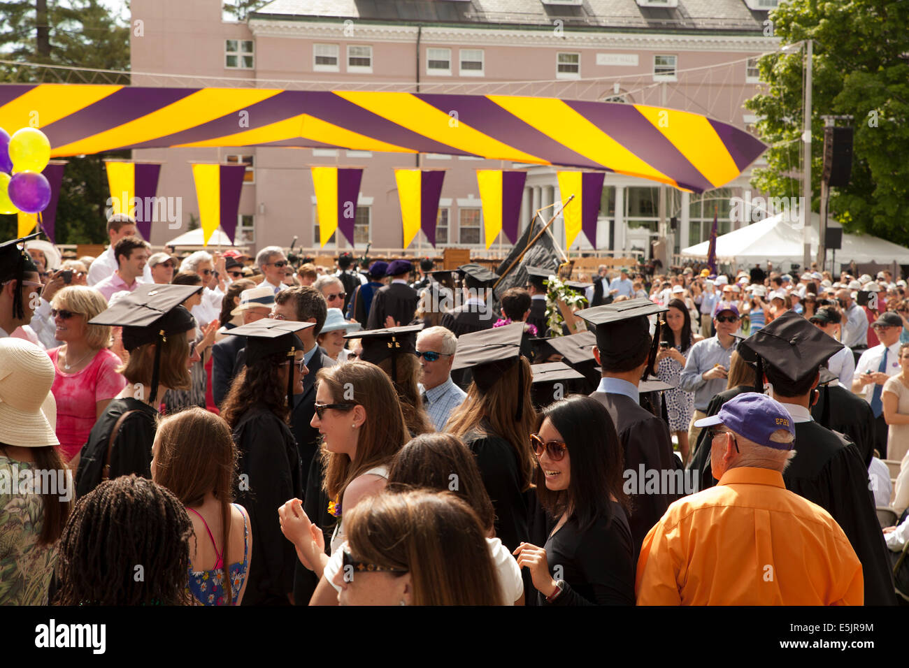 Graduating students parade into the seating area before their ...