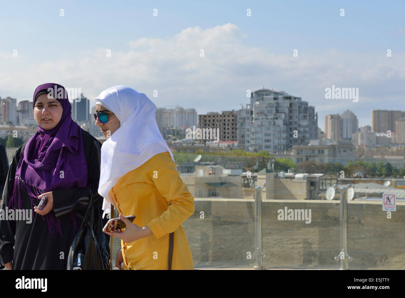 Two women on viewing platform of the Maiden Tower, Old City, Baku ...