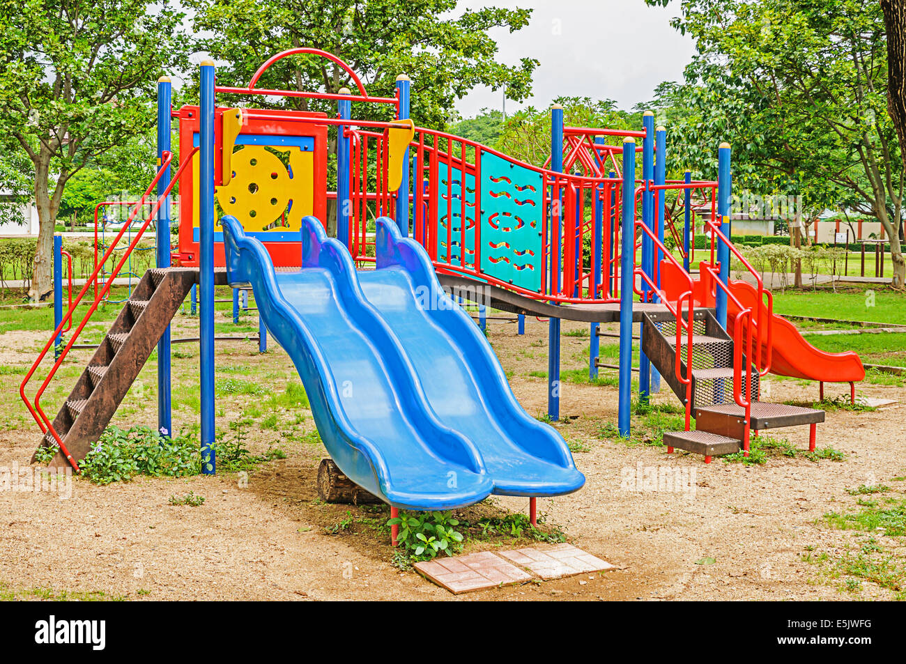 Colorful playground equipment in the public park Stock Photo - Alamy