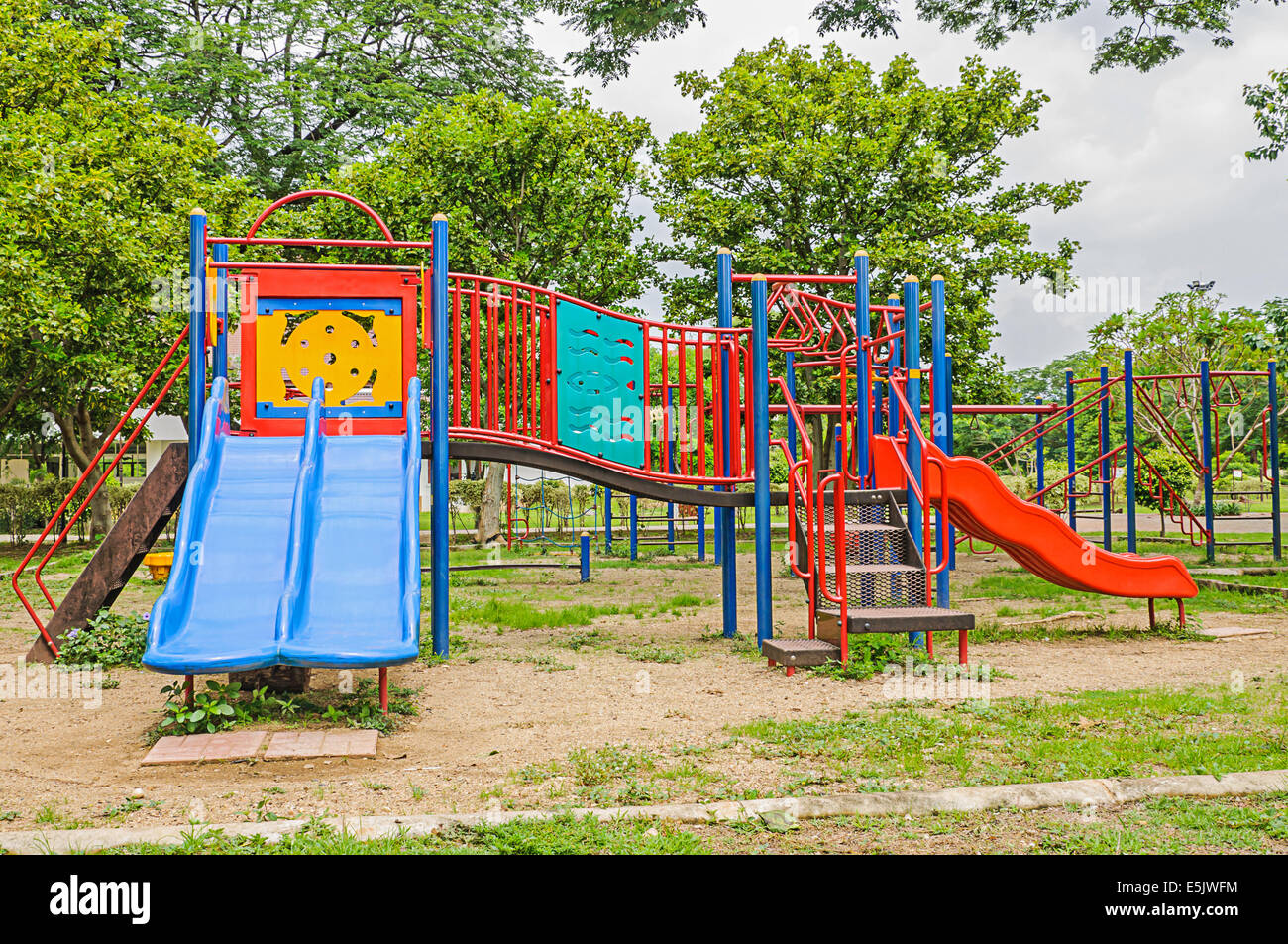 Colorful playground equipment in the public park Stock Photo - Alamy