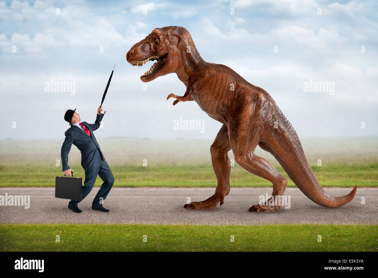 hostile business takeover concept businessman and tyrannosaurus ...